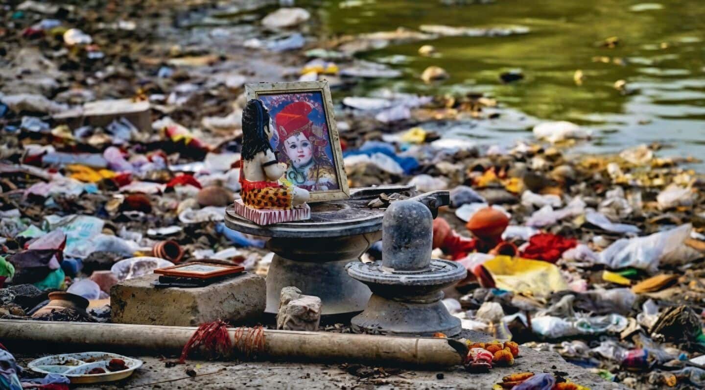 Yamuna water level drop reveals religious waste at Delhi ghats